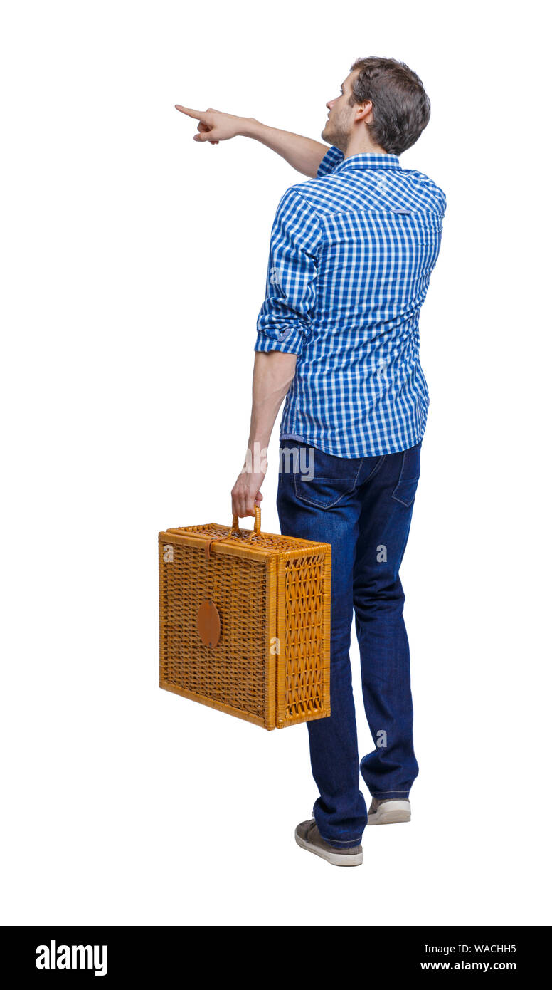 Back view of pointing man walking with a picnic bag. backside view of ...