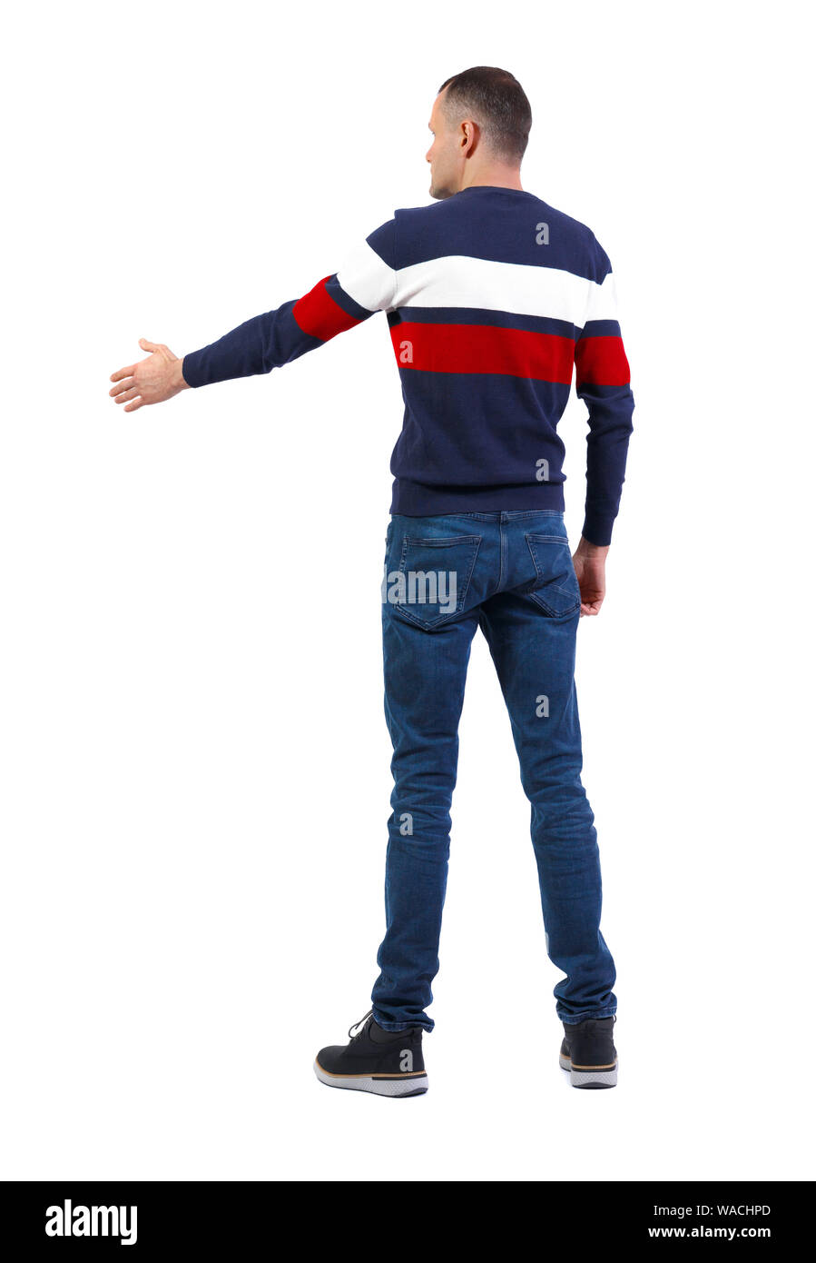 Back view of a man who stretches his hand for a handshake. Rear view ...