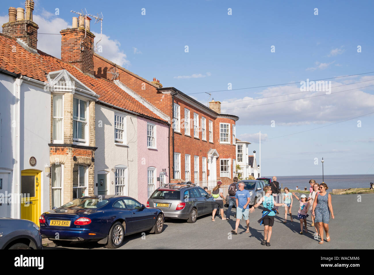 Family enjoying a sunny day at the coastal town of Southwold, Suffolk ...