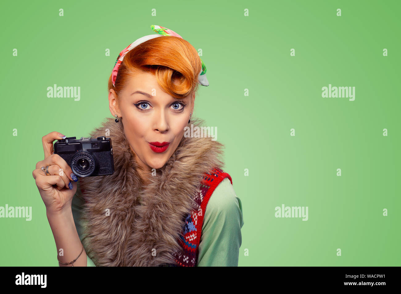 Beautiful smiling young pinup style woman girl shows dslr digital photo ...