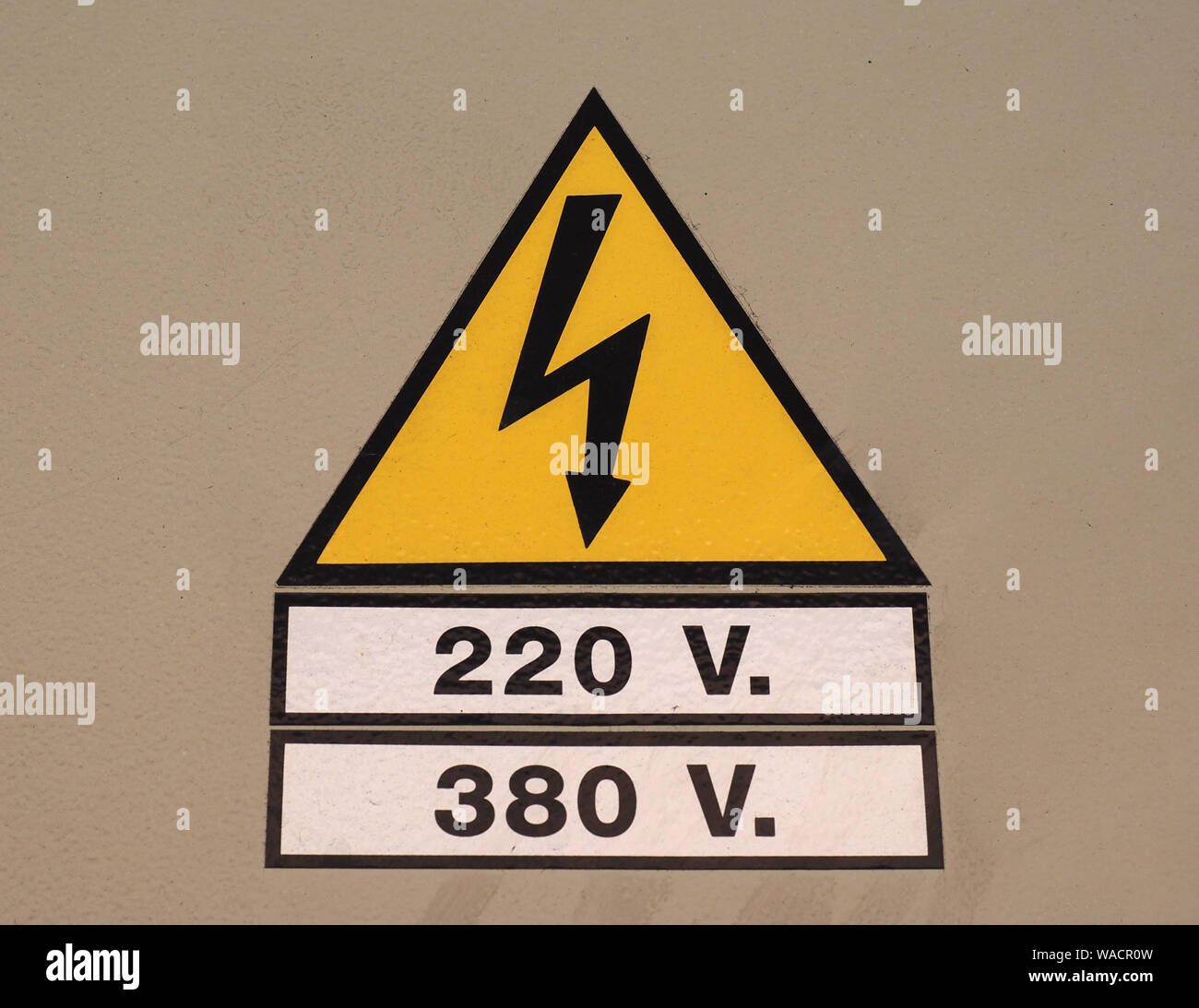 warning sign for high tension danger of electrocution Stock Photo - Alamy