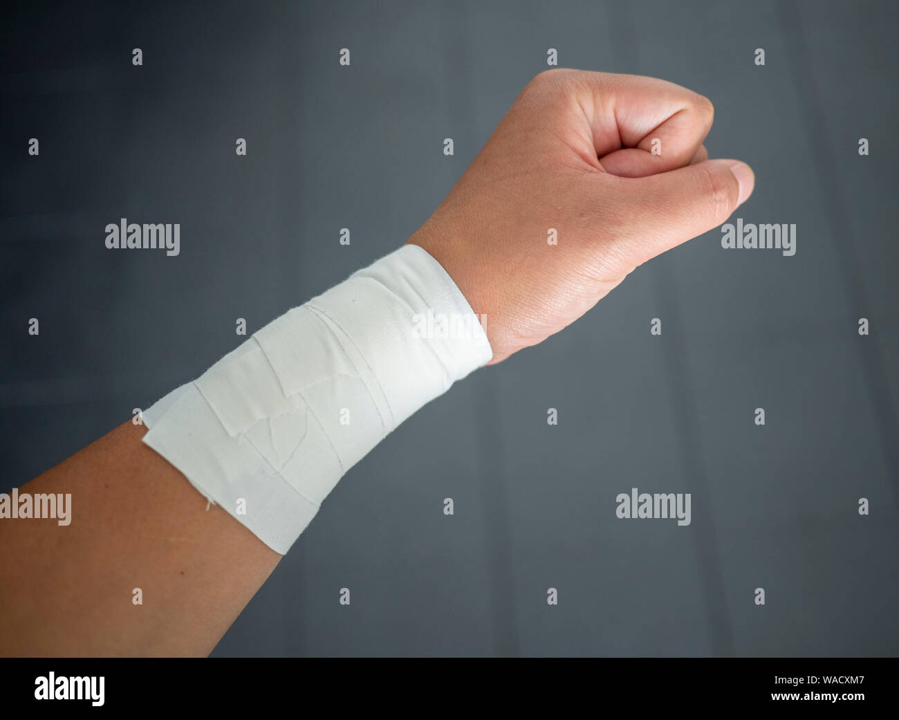 Making a fist with a wrist tape job Stock Photo - Alamy