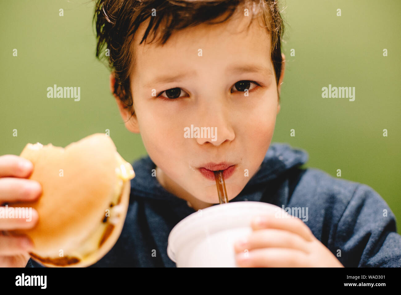 Child eating fast food restaurant hi-res stock photography and images ...