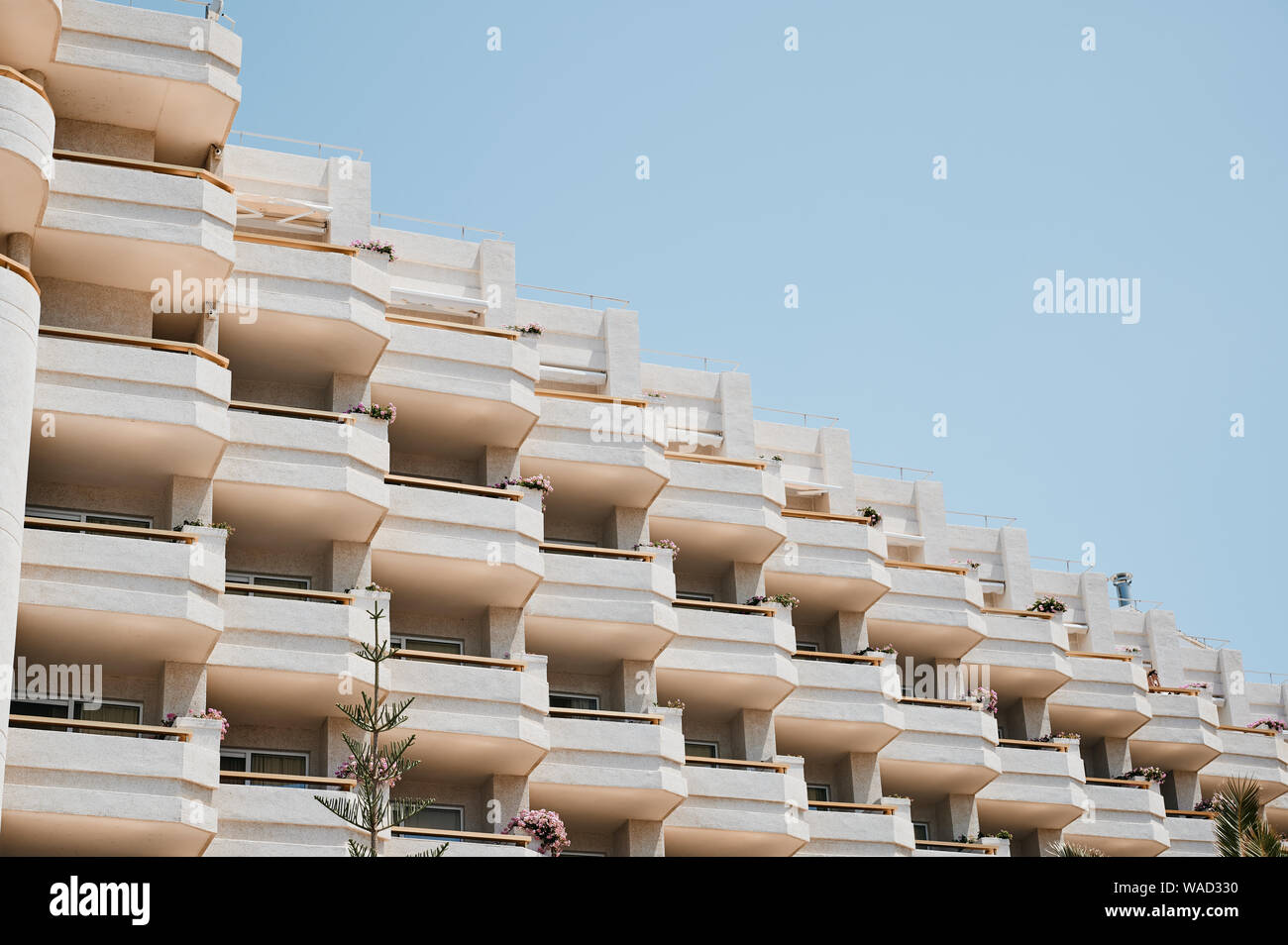 Exterior of contemporary resort hotel building with stepped terrace ...