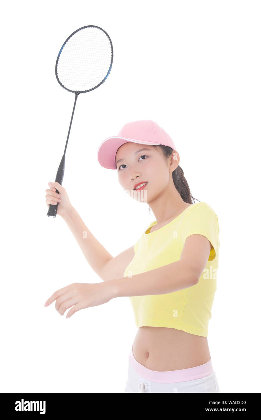 Portrait of a beautiful Asian woman holding a badminton racket isolated ...