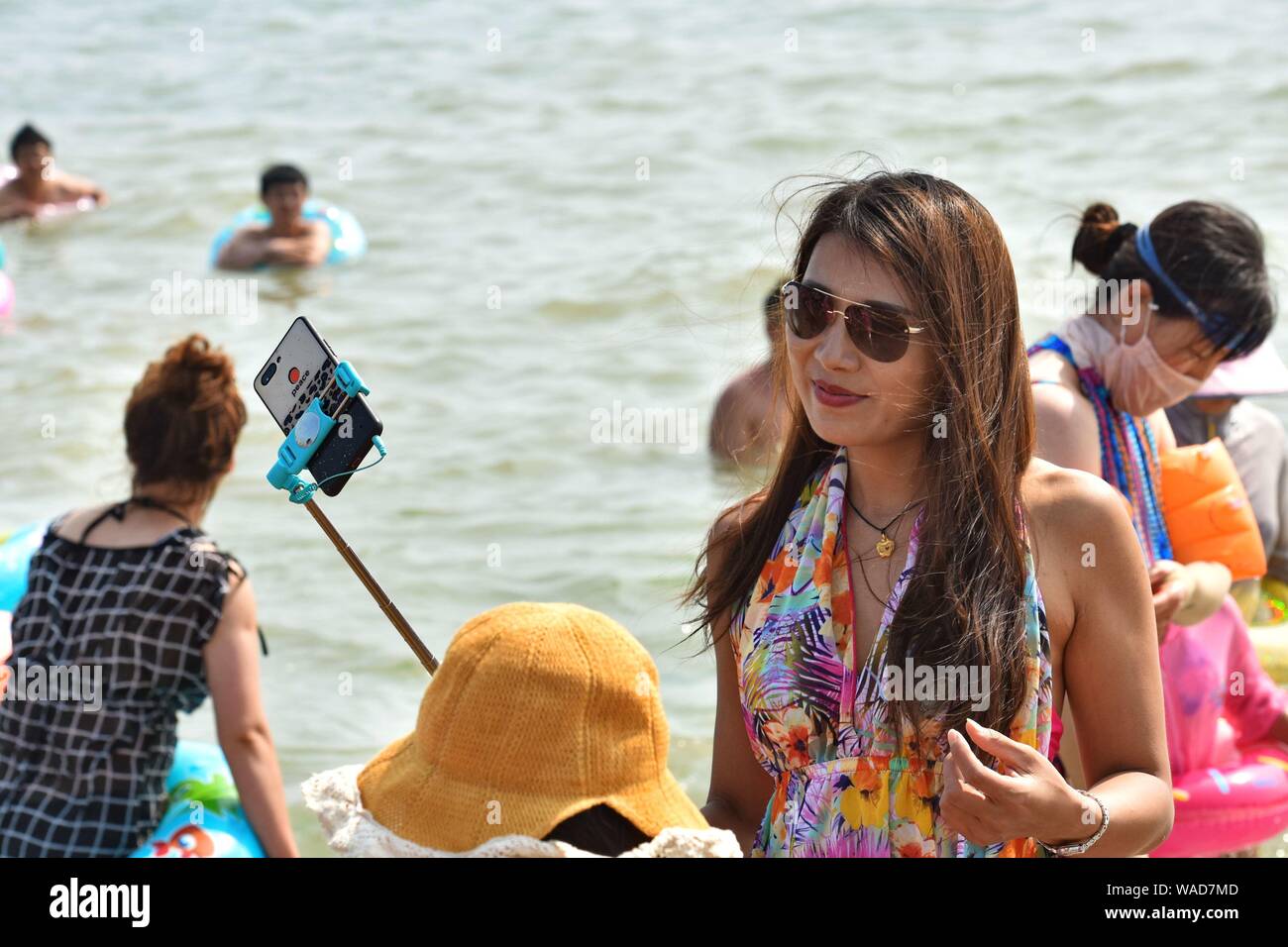 Holidaymakers crowd a beach resort to cool off on a scorching day in ...
