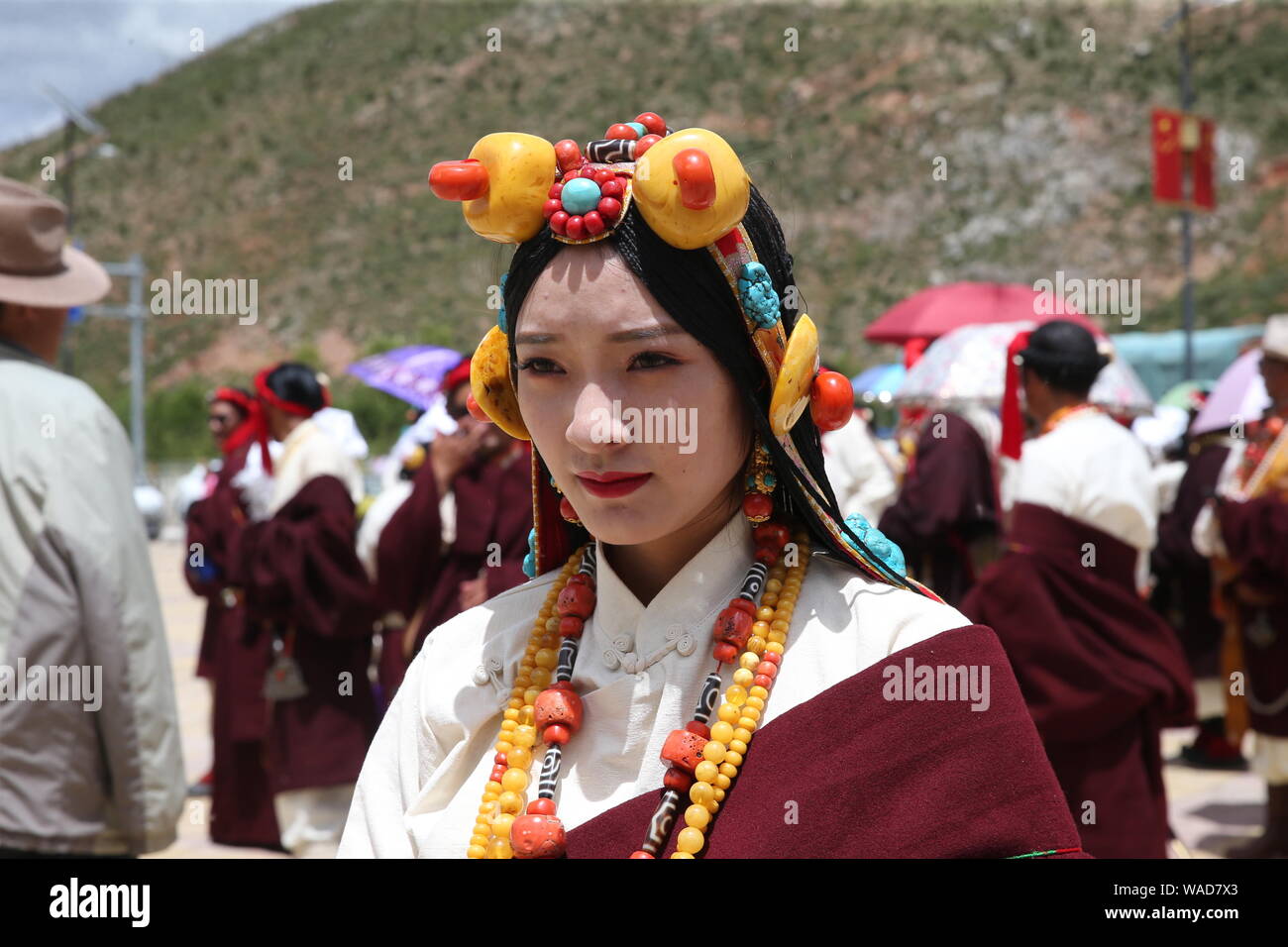 An entertainer dressed in Kangba costumes, one branch of the Tibetan ...