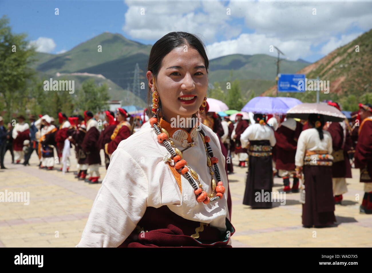 An entertainer dressed in Kangba costumes, one branch of the Tibetan ...