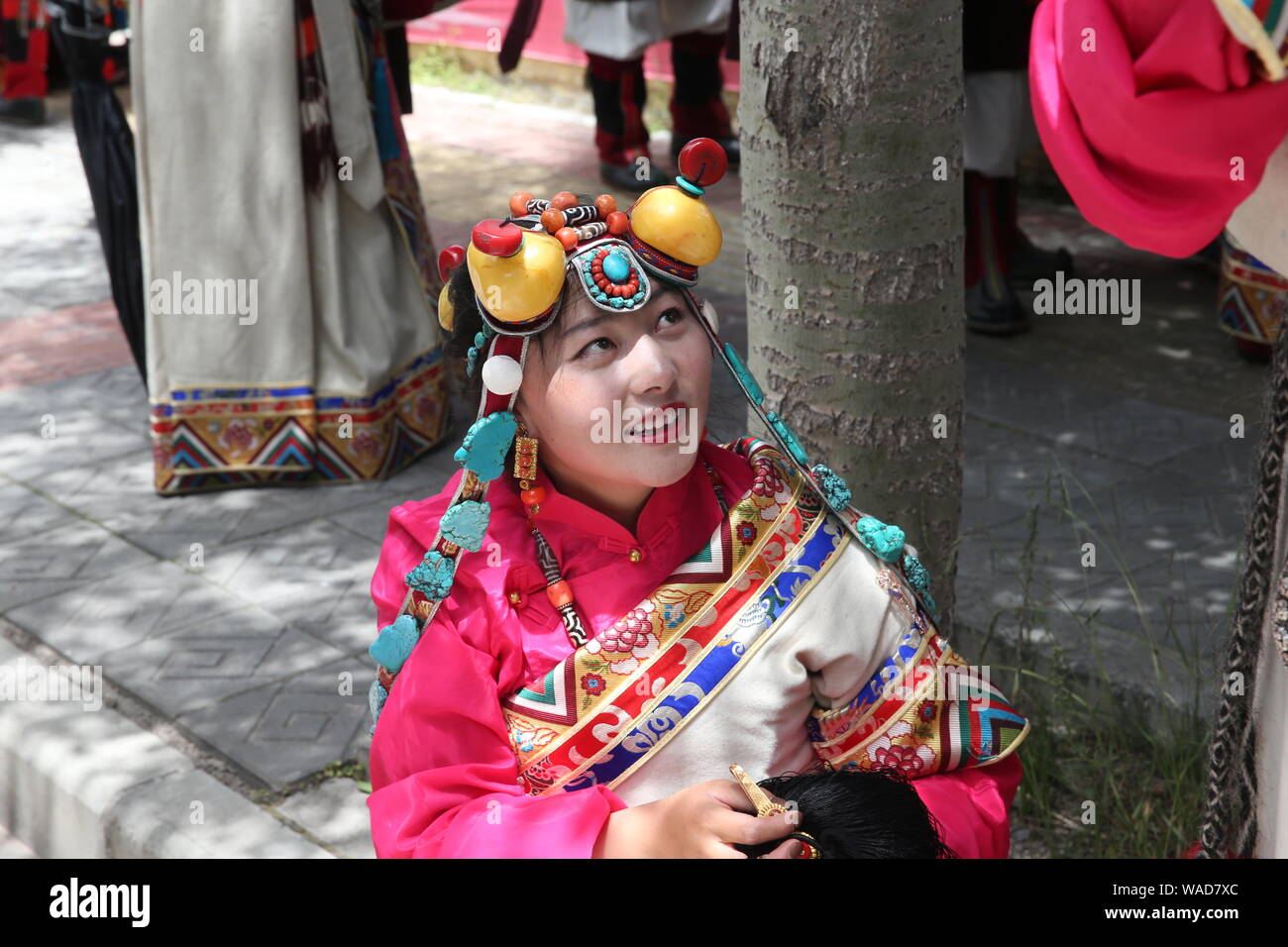 An entertainer dressed in Kangba costumes, one branch of the Tibetan ...