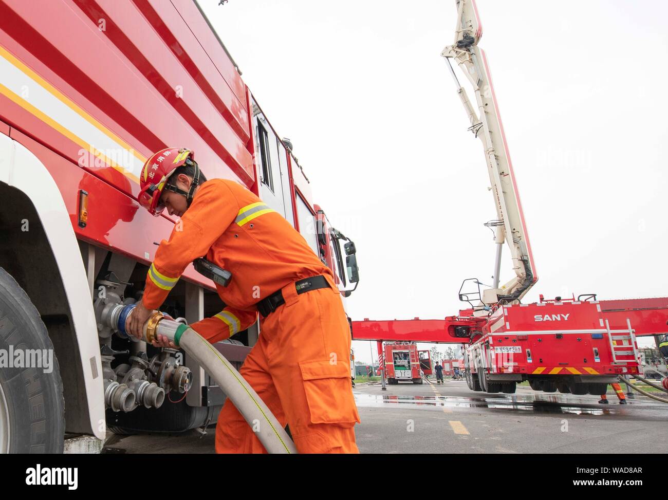 Chinese firefighters take part in the first fire drill at the Beijing ...