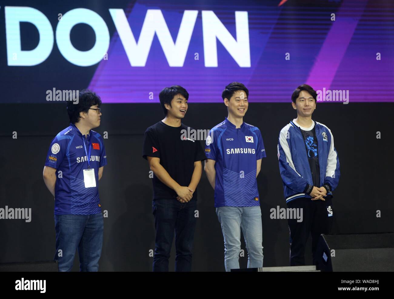 Participants pose before competing in the e-sports games during the WCG 2019 finals in Xi'an ...