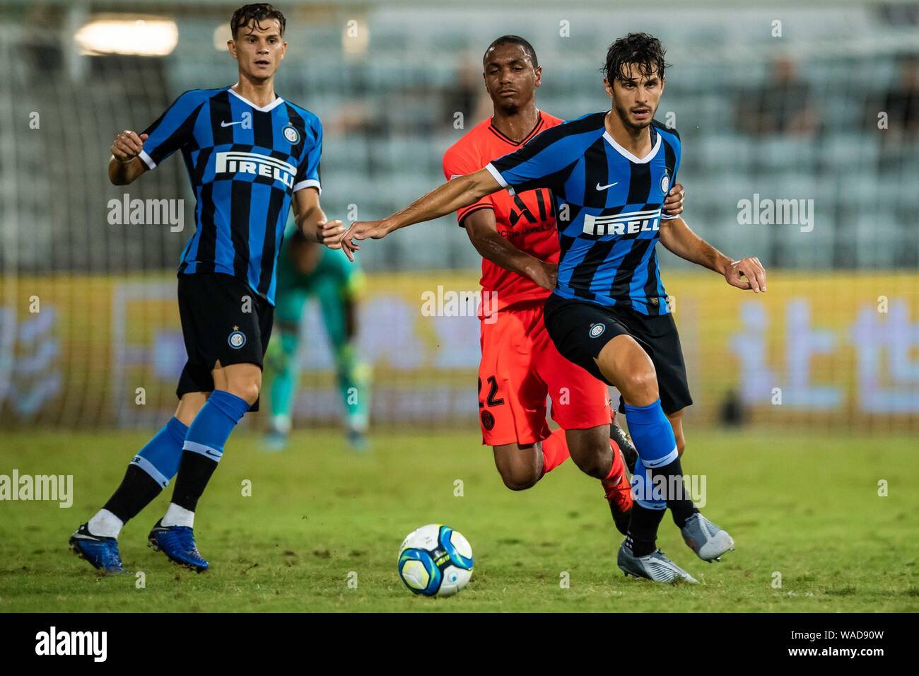 Abdou Diallo, center, of Paris Saint-Germain F.C. challenges a player ...