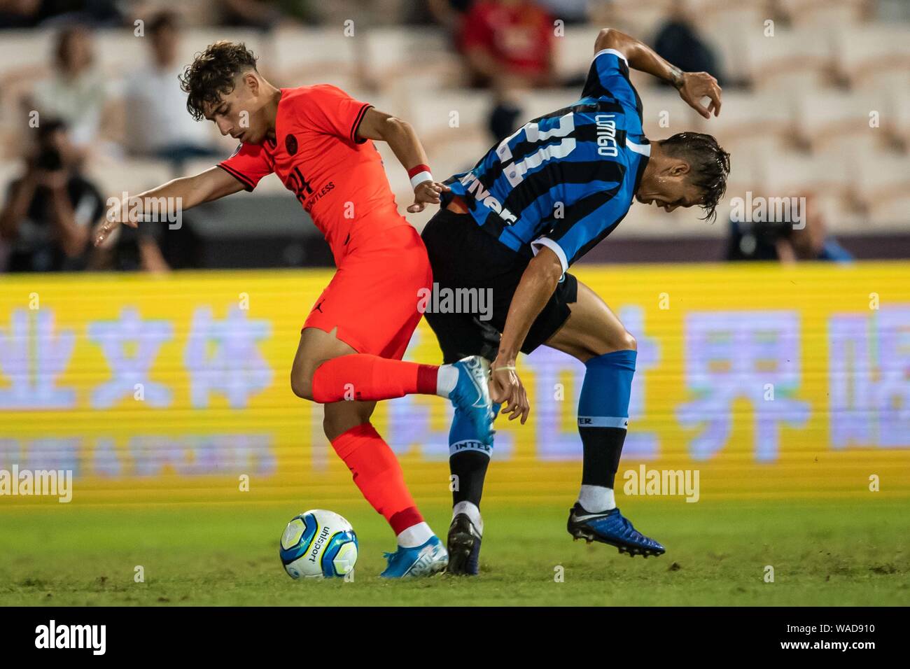 Samuele Longo, right, of Inter Milan challenges a player of Paris Saint ...
