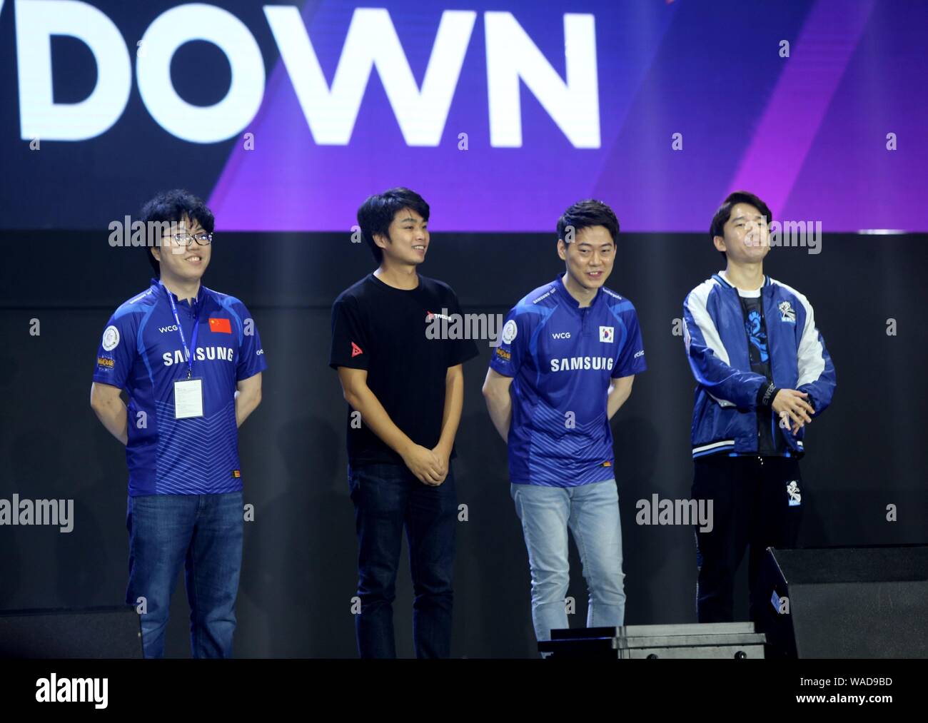 Participants pose before competing in the e-sports games during the WCG 2019 finals in Xi'an ...