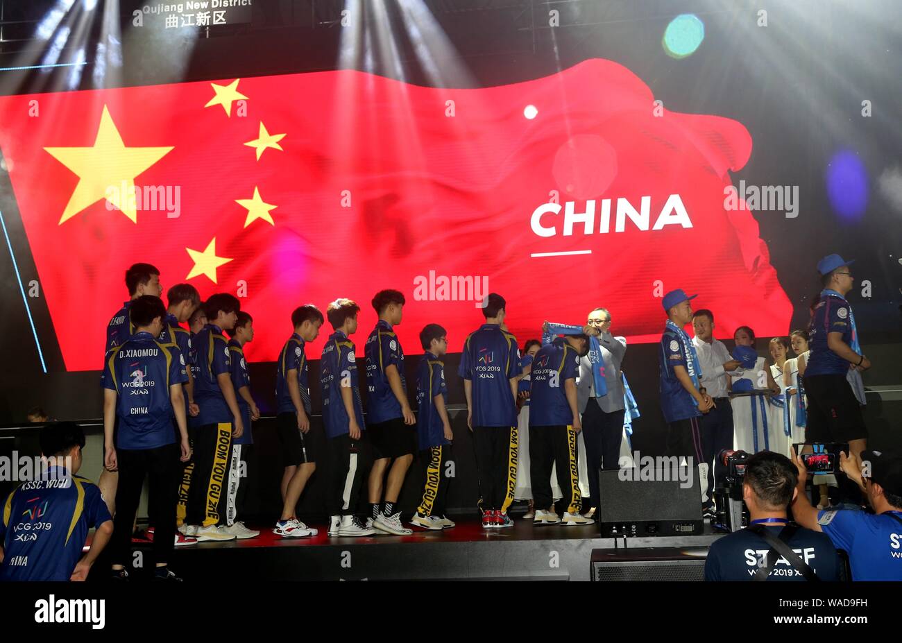 Chinese participants pose with their trophy during the WCG 2019 finals in Xi'an city, northwest ...
