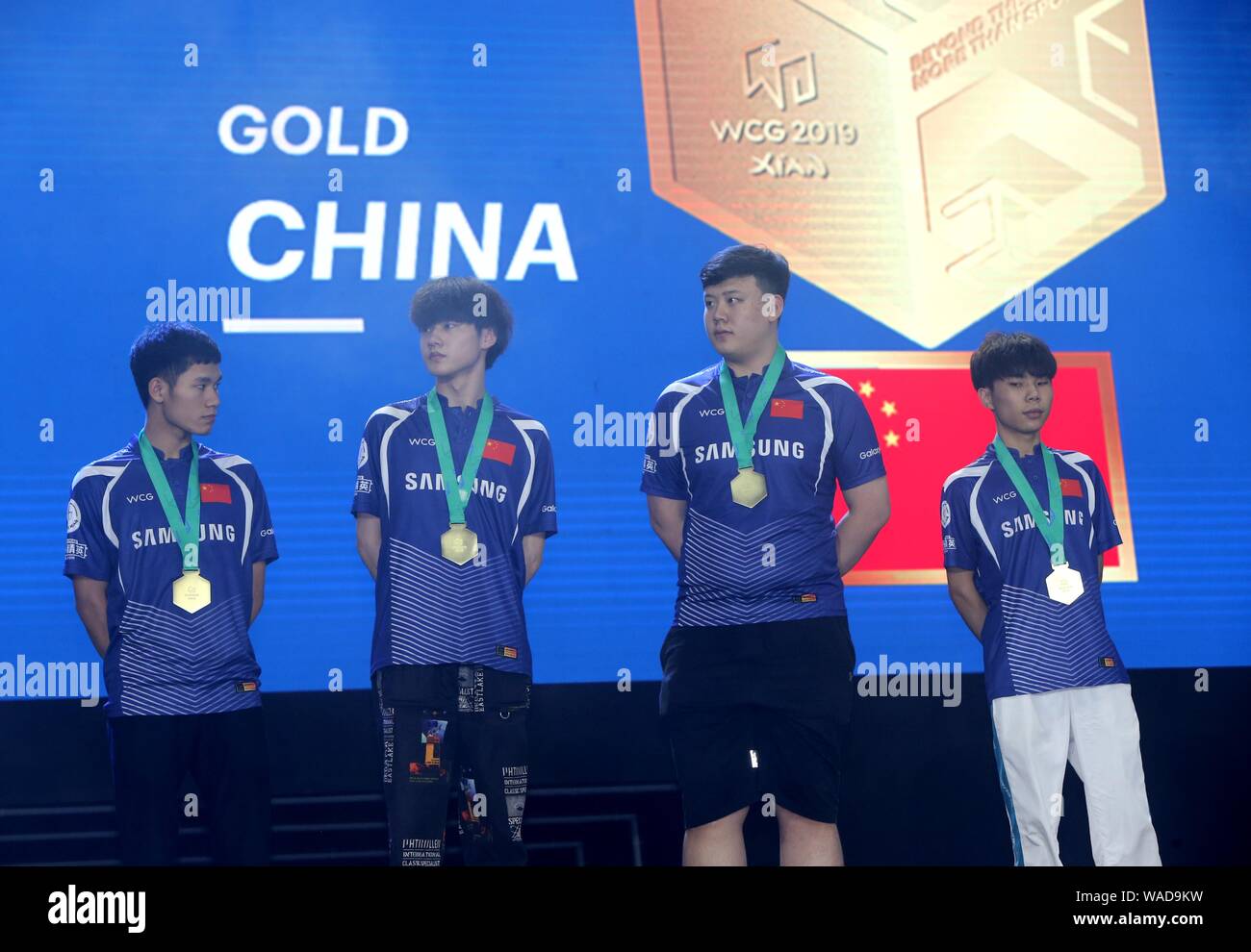 Chinese participants pose with their gold medals during the WCG 2019 finals in Xi'an city ...