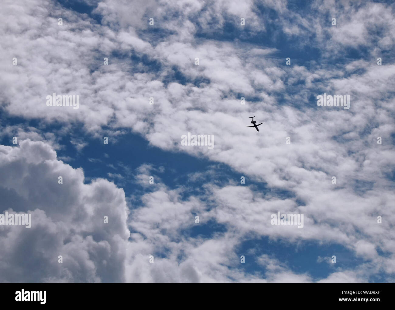 Airplane flying in dark clouds hi-res stock photography and images - Alamy