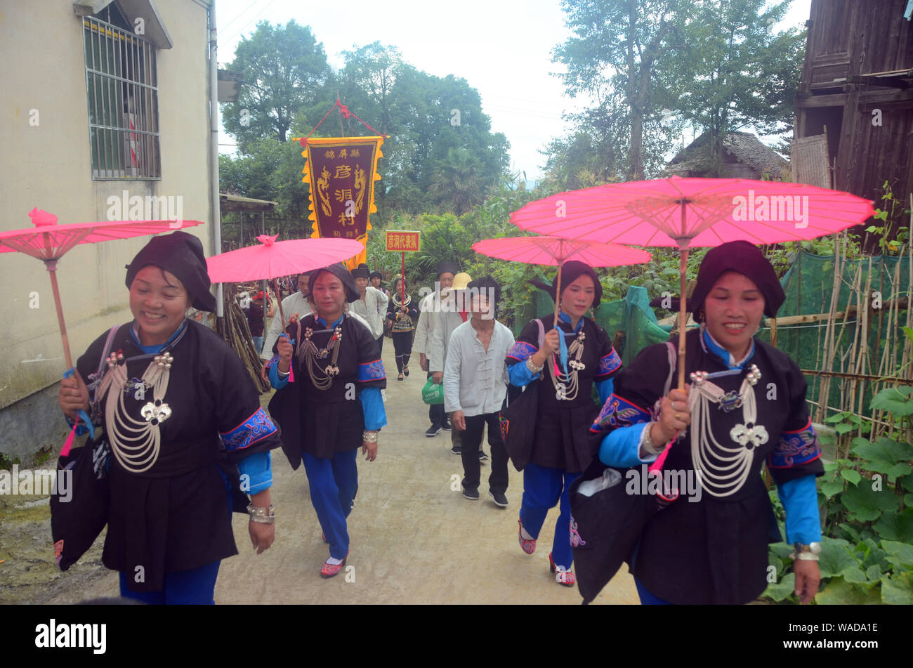 Chinese people of Dong ethnic group dressed in traditional costumes ...