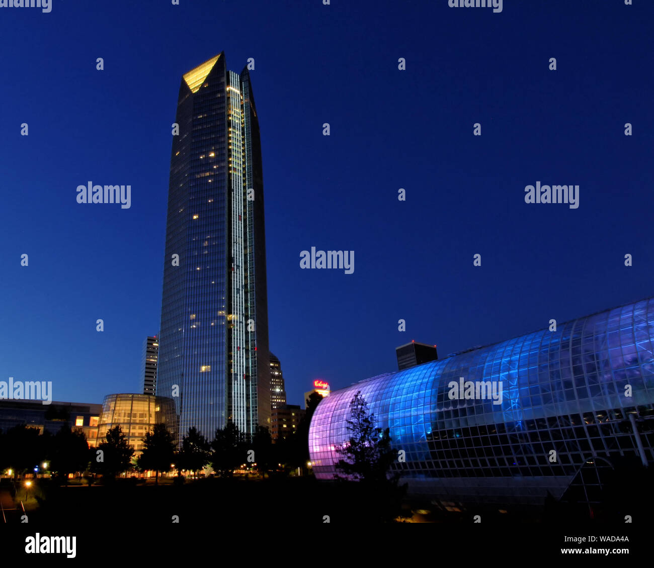 The Devon Tower and Myriad Gardens Crystal Bridge glow in evening ...