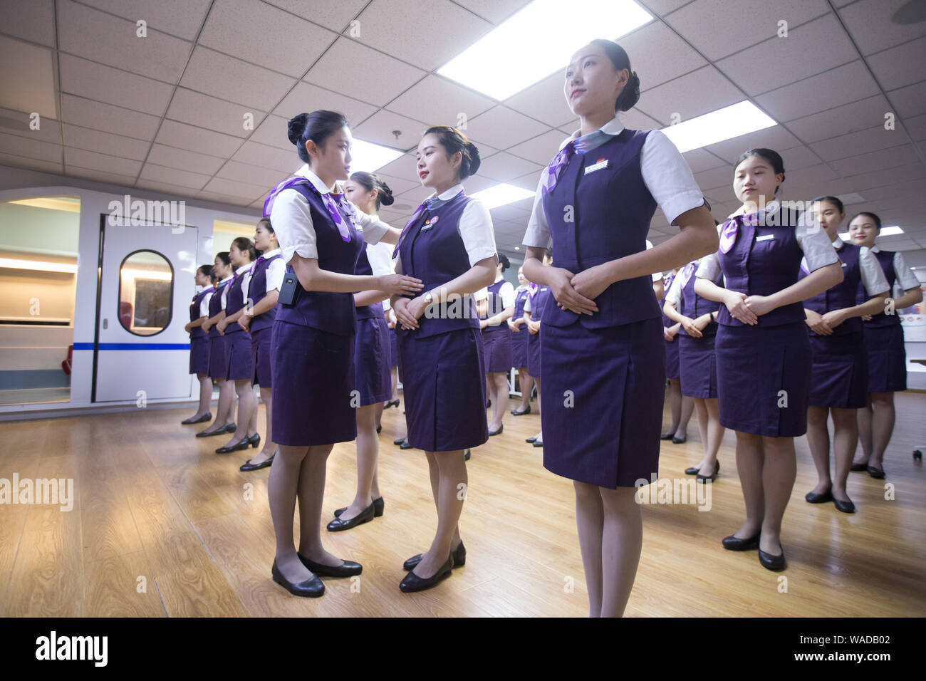Chinese high-speed train attendants pose during a training session in ...