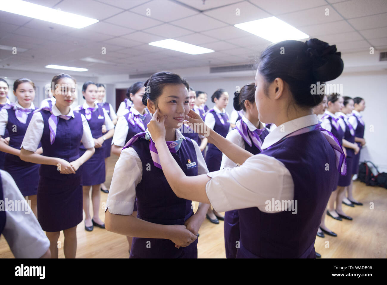 Chinese high-speed train attendants pose during a training session in ...