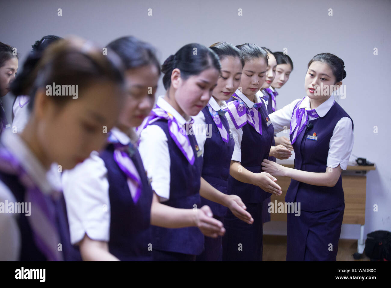 Chinese high-speed train attendants pose during a training session in ...