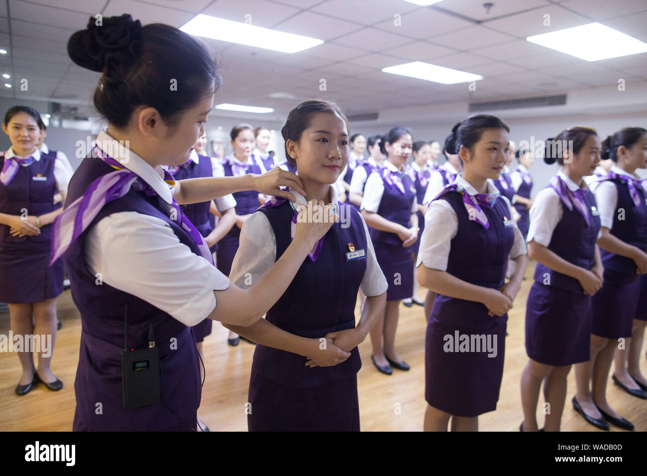 Chinese high-speed train attendants pose during a training session in ...