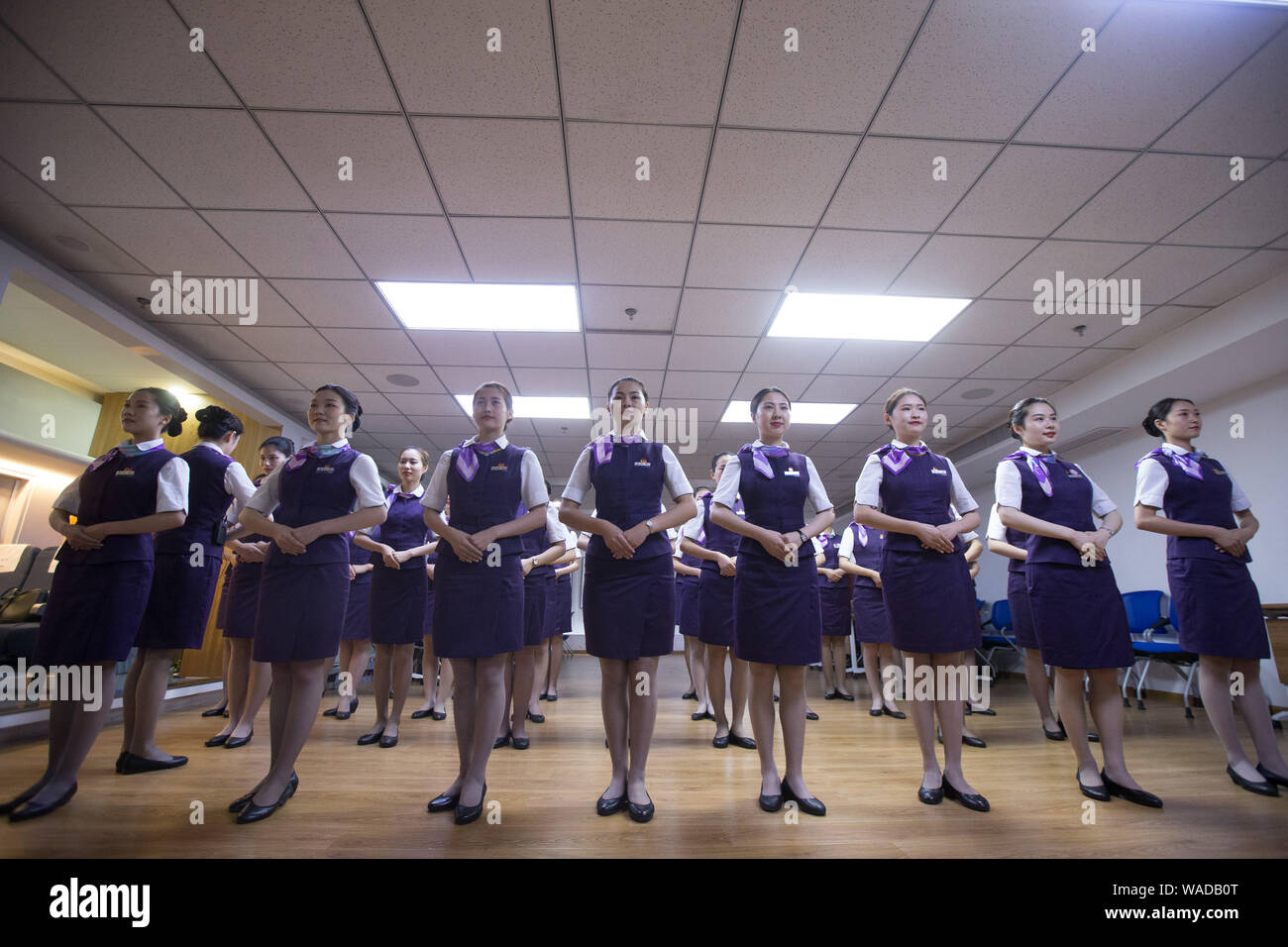 Chinese high-speed train attendants pose during a training session in ...
