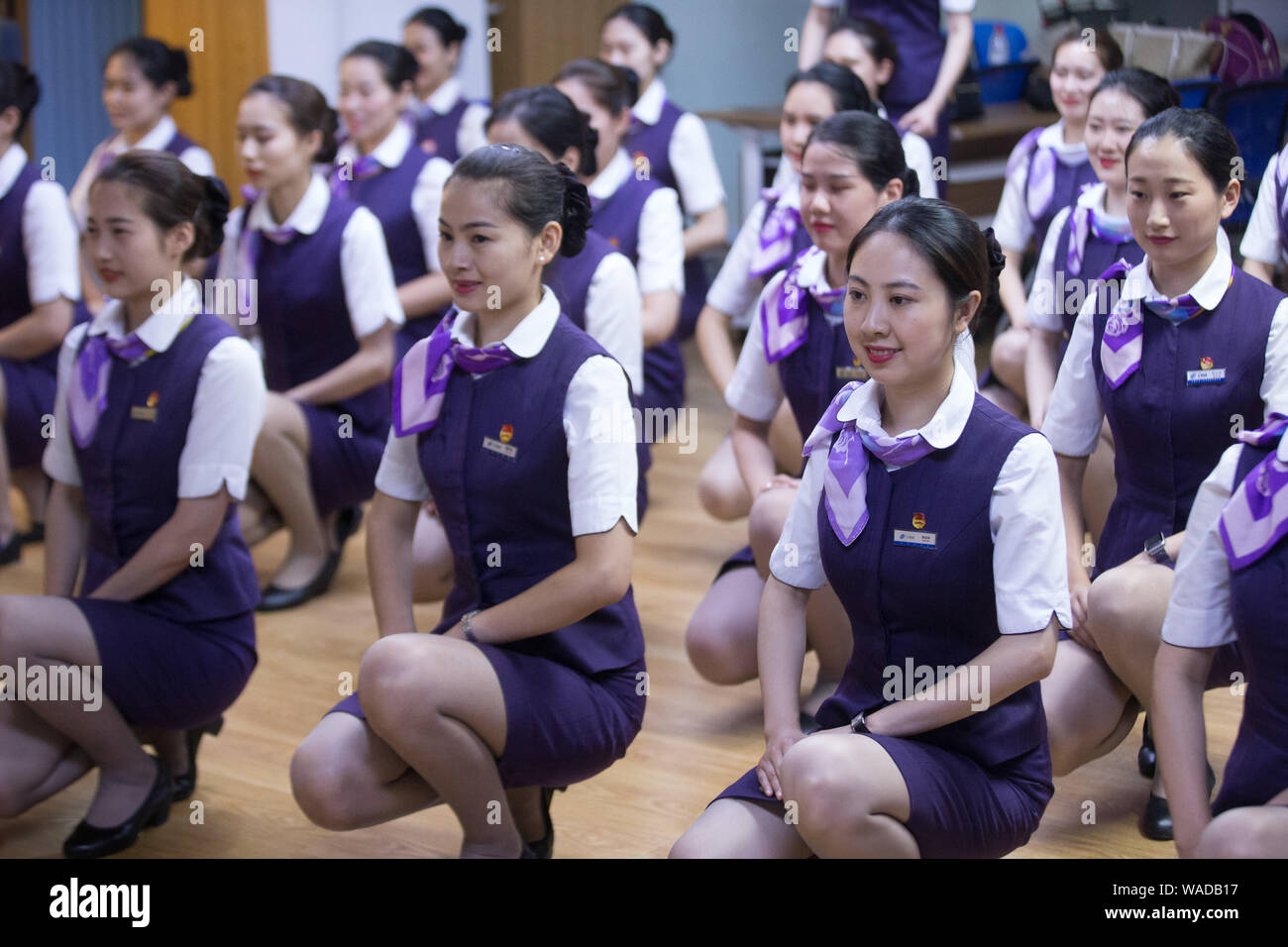Chinese high-speed train attendants pose during a training session in ...