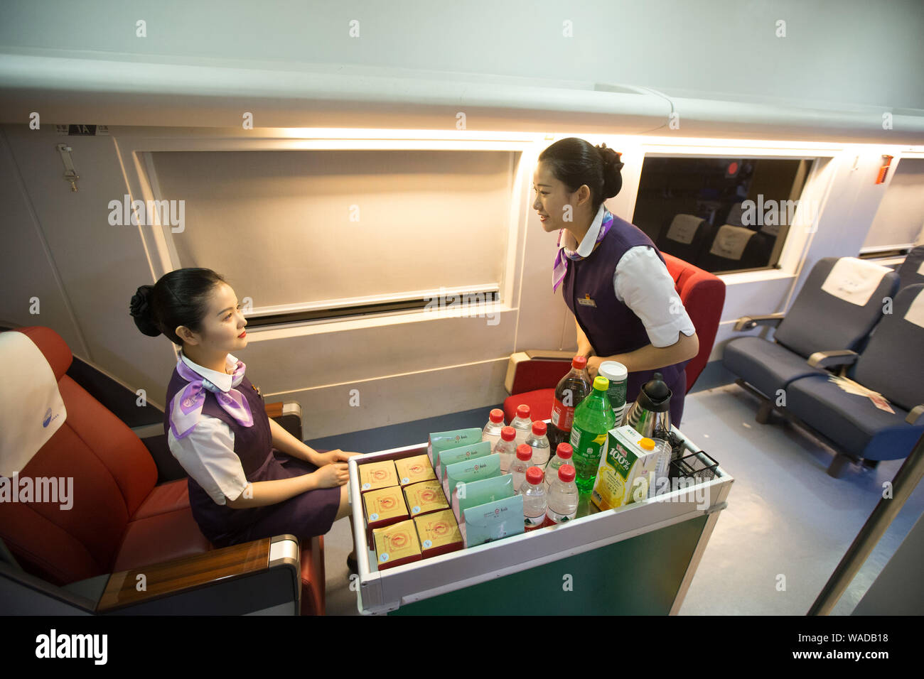Chinese high-speed train attendants attend a training session in ...