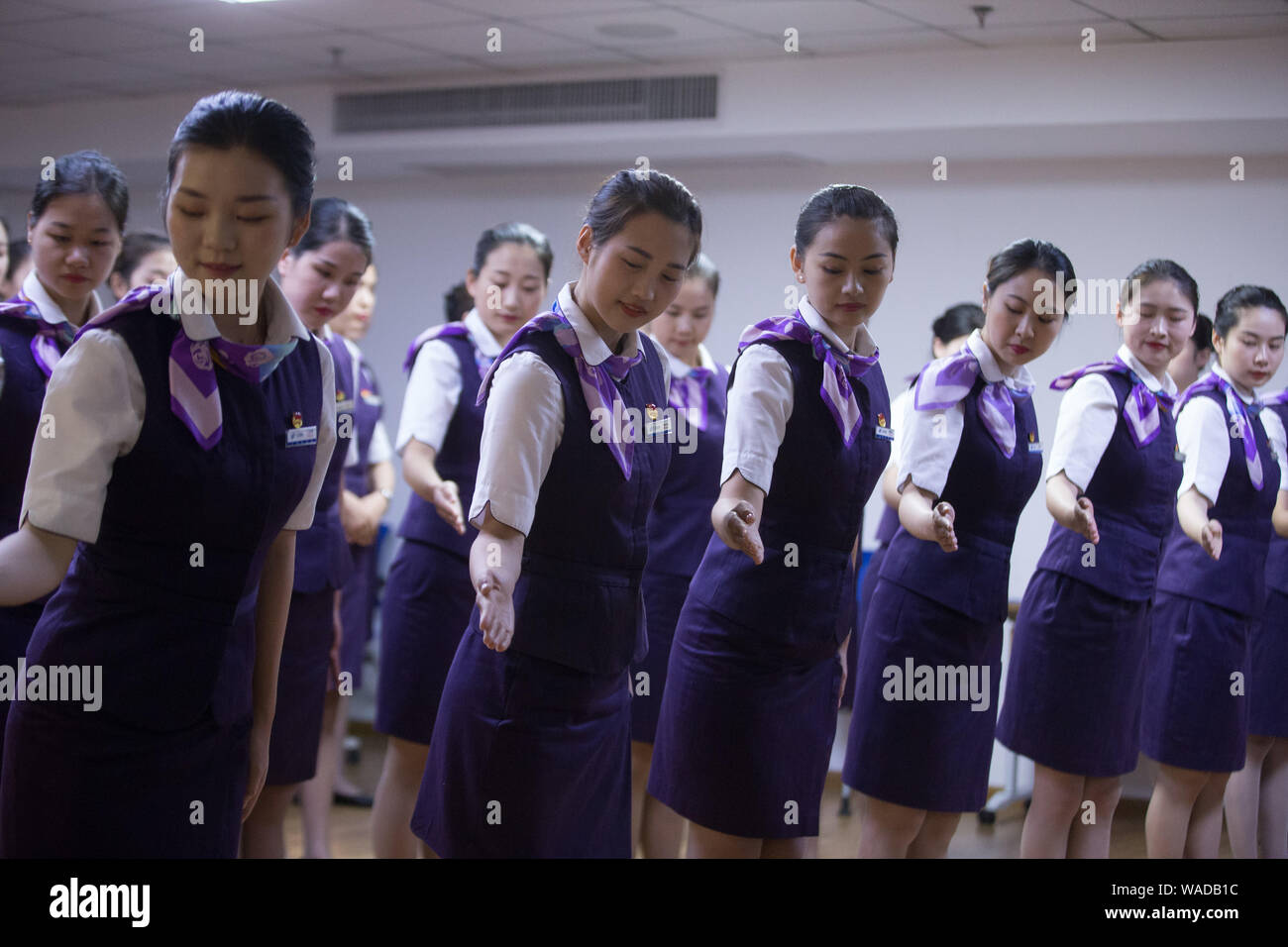 Chinese high-speed train attendants pose during a training session in ...