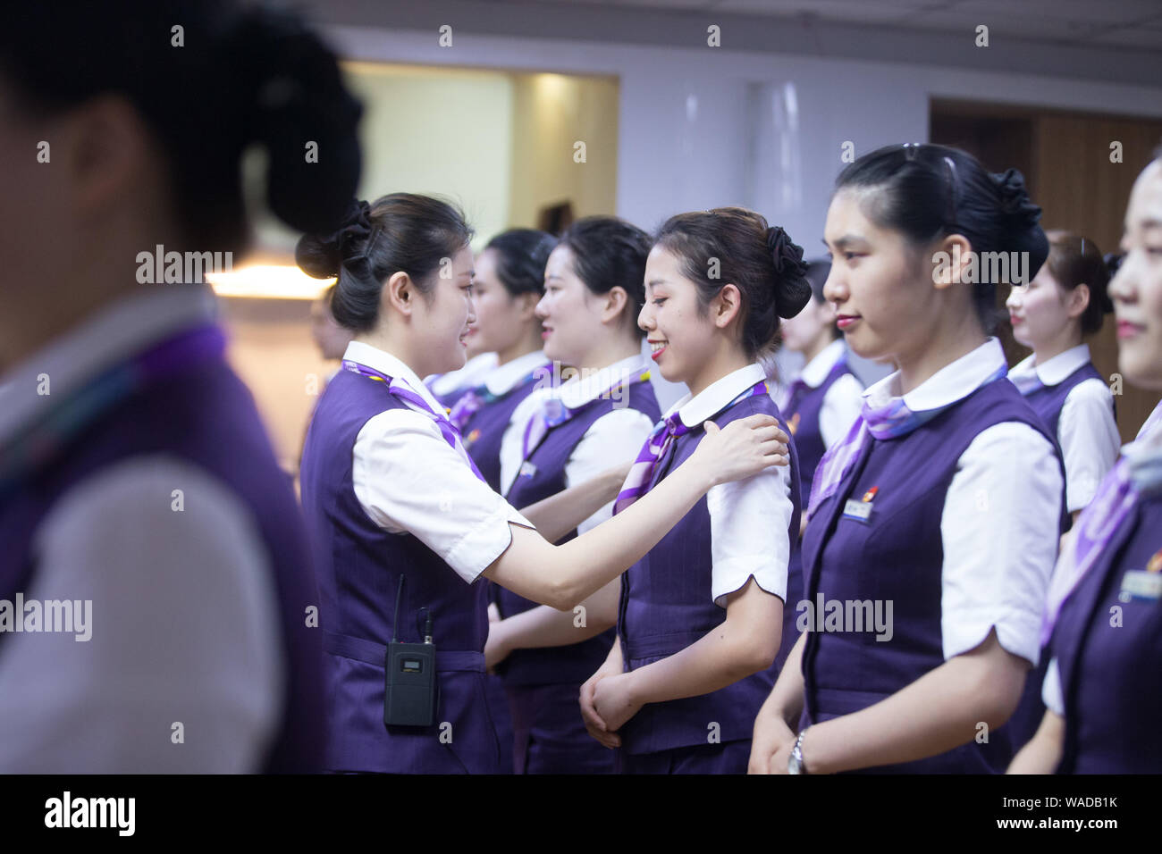 Chinese high-speed train attendants pose during a training session in ...