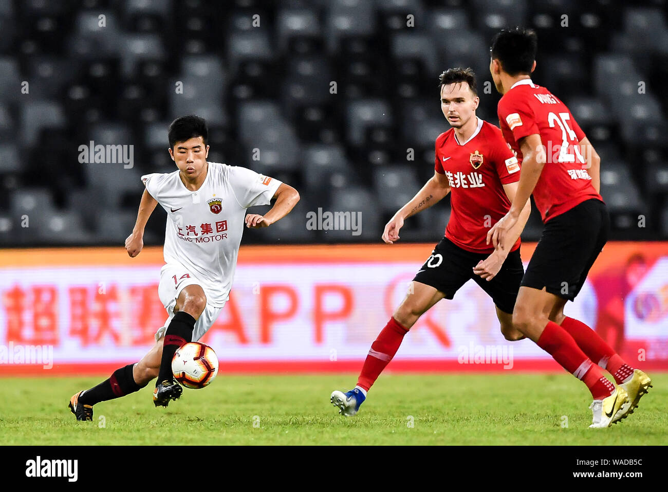 Norwegian football player Ole Selnaes, right, of Shenzhen F.C ...