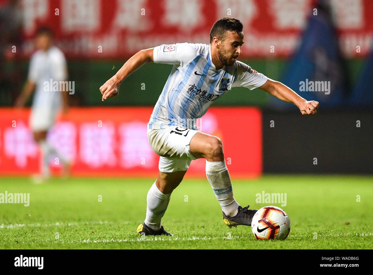 Israeli-Arab football player Dia Saba of Guangzhou R&F shots the ball ...