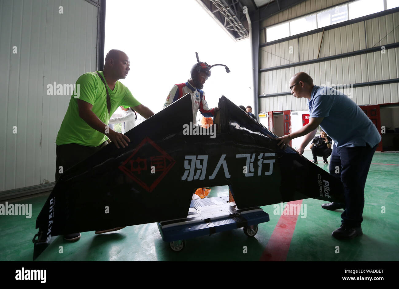 Chinese athlete Sheng Guangqiang wears a jetwing powered by turbojet ...