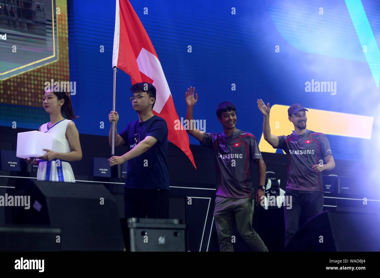 Participants pose before competing in the e-sports games during the WCG 2019 finals in Xi'an ...