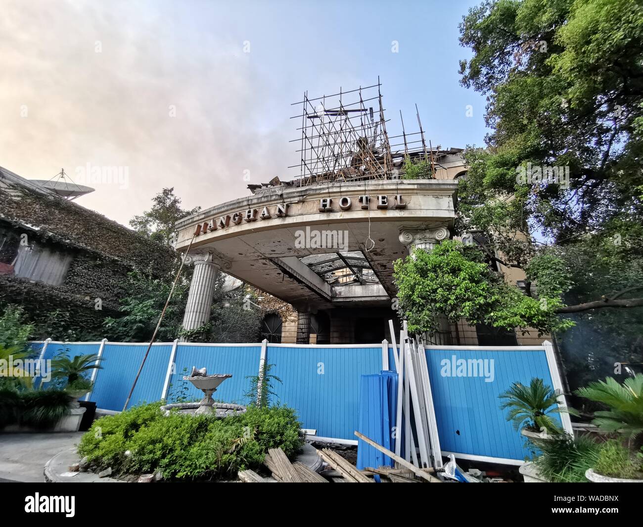 Chinese firefighters spray water to distinguish the fire after a fire ...