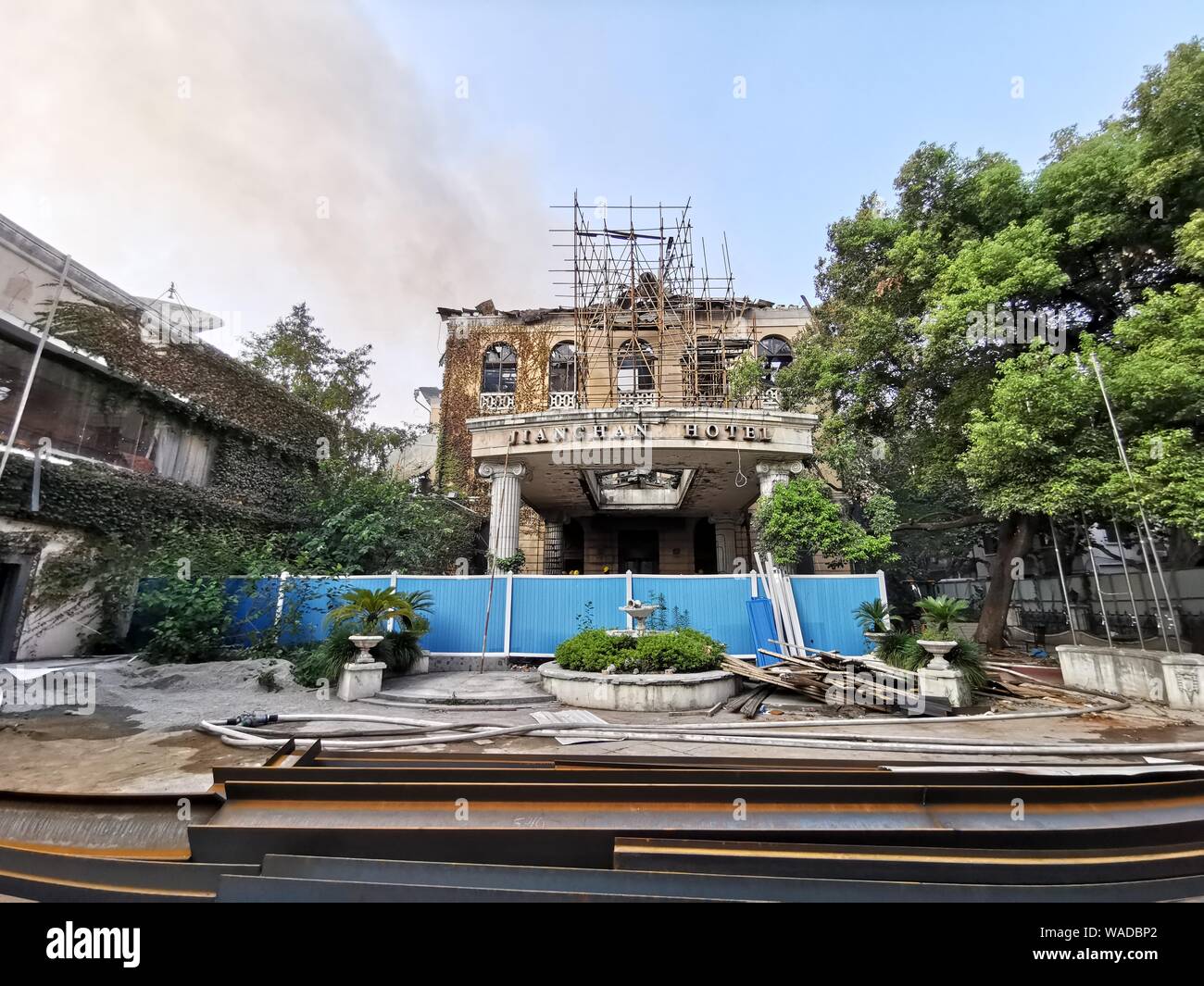 Chinese firefighters spray water to distinguish the fire after a fire ...