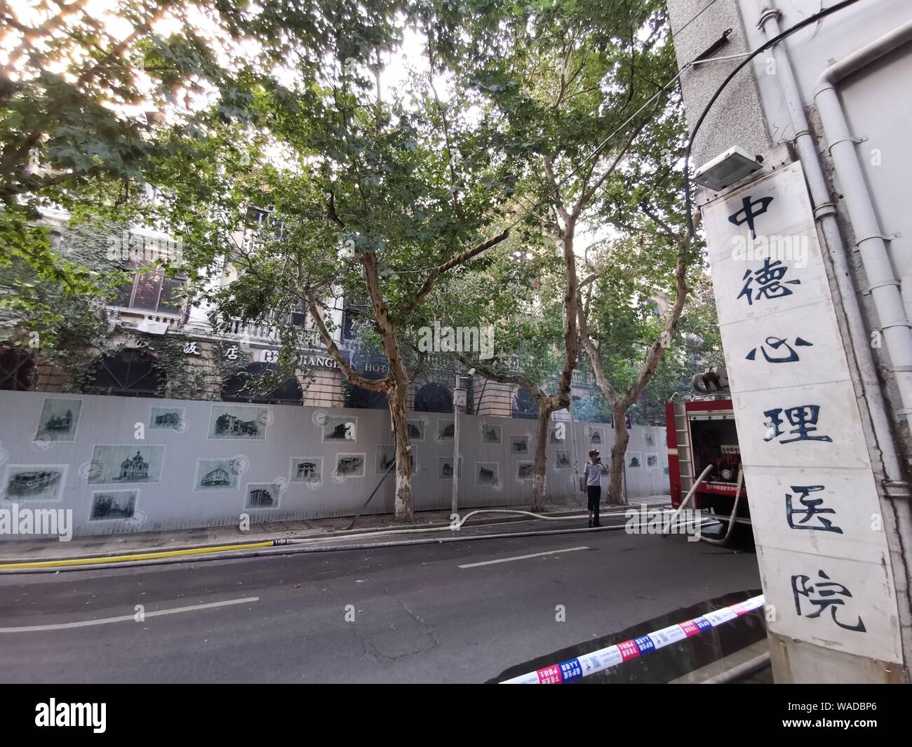 Chinese firefighters spray water to distinguish the fire after a fire ...