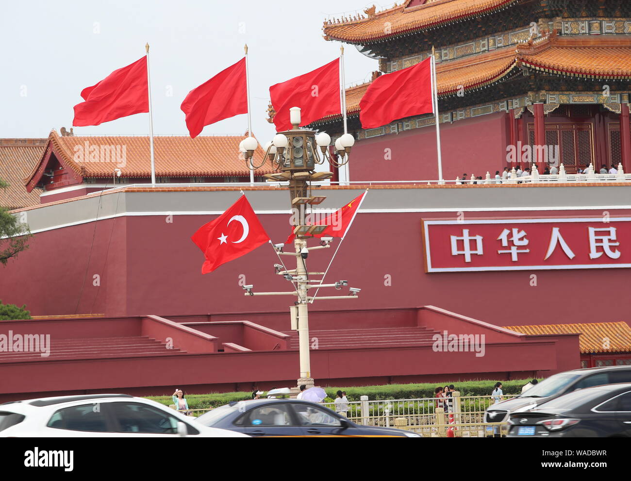 National flags of China and Turkey flutter on a lamppost in front of ...