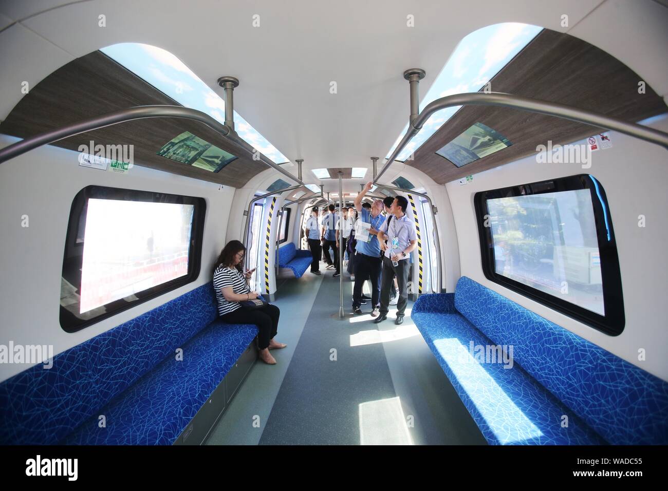 Visitors view a new generation carbon fiber metro car Visitors view a new generation carbon fiber metro car