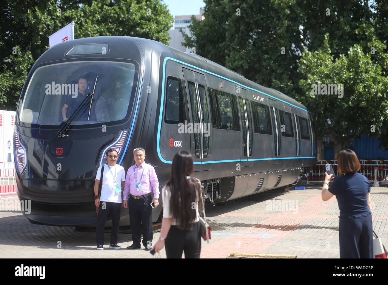 Visitors pose for photos with a new generation carbon fiber metro car ... Visitors pose for photos with a new generation carbon fiber metro car ...
