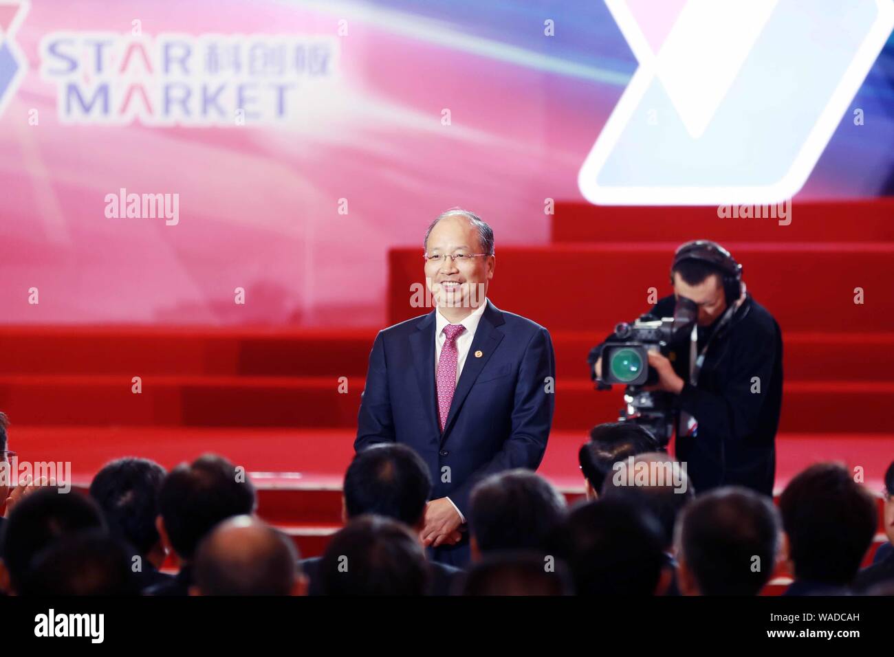 Representatives of 25 companies attend the listing ceremony of the ...