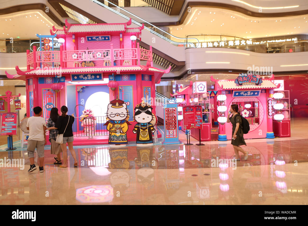 Cartoon characters from Hello Kitty dressed in traditional costumes of ...