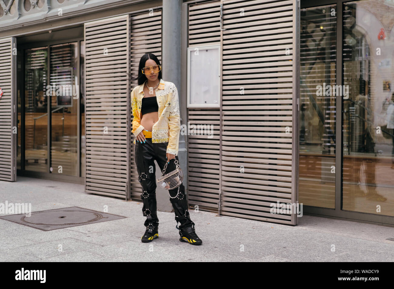 Trendy women and men pose for street snap during the Paris Fashion Week ...
