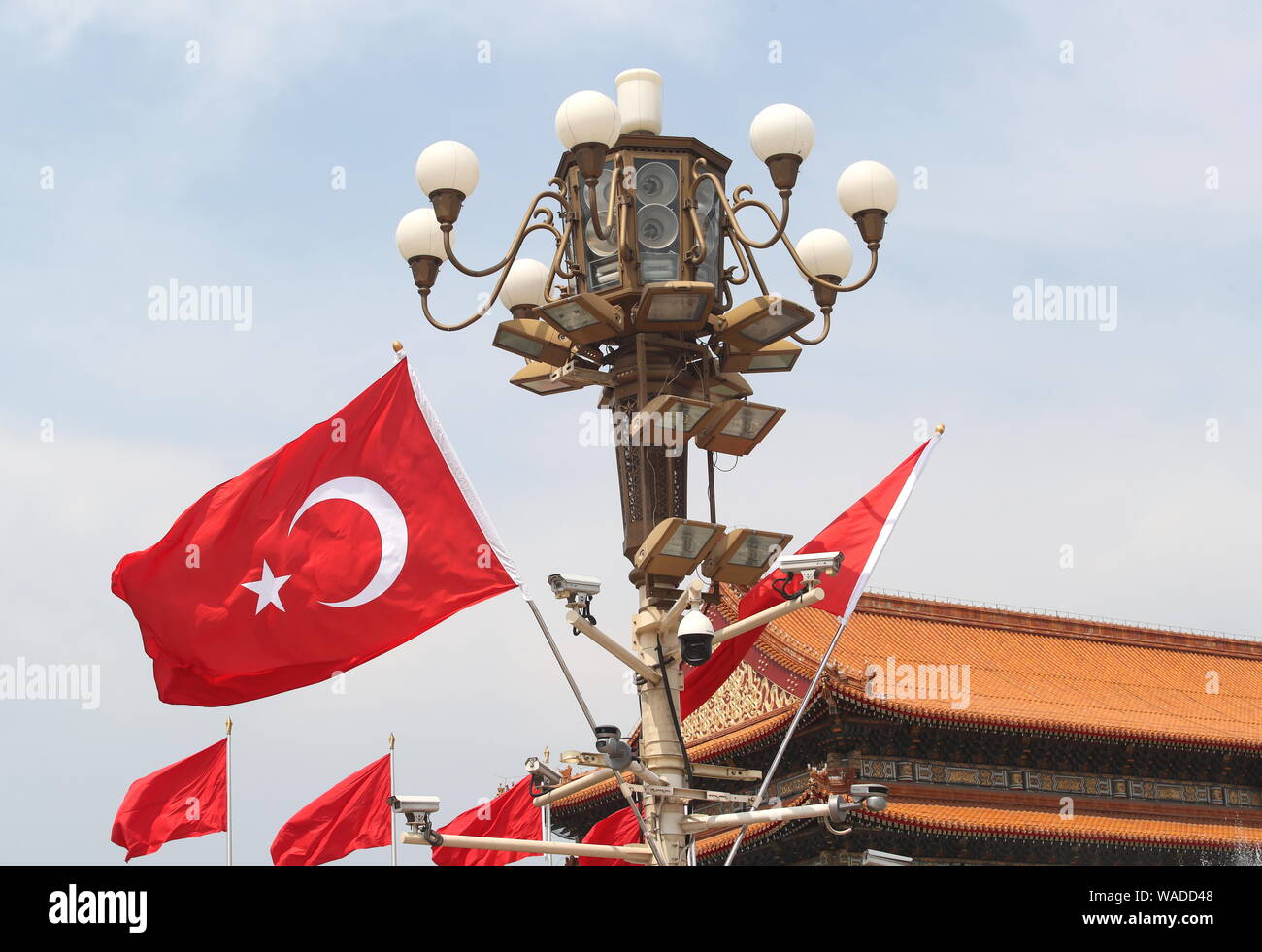 National flags of China and Turkey flutter on a lamppost in front of ...