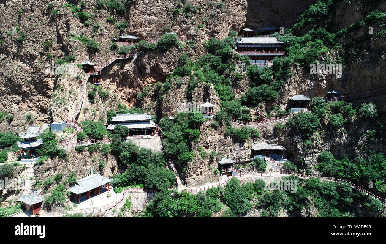 A total of 28 ancient Taoist temples built on the cliff are seen in ...