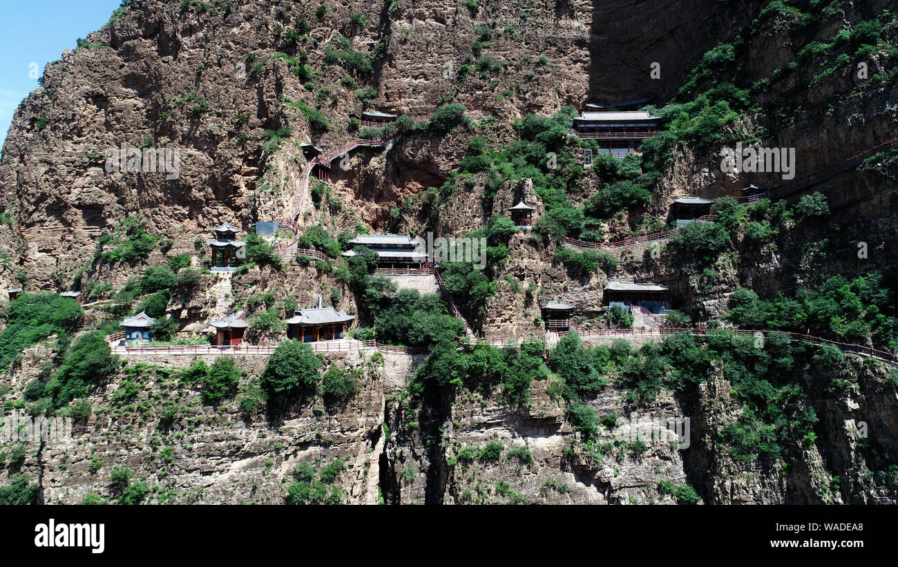 A total of 28 ancient Taoist temples built on the cliff are seen in ...