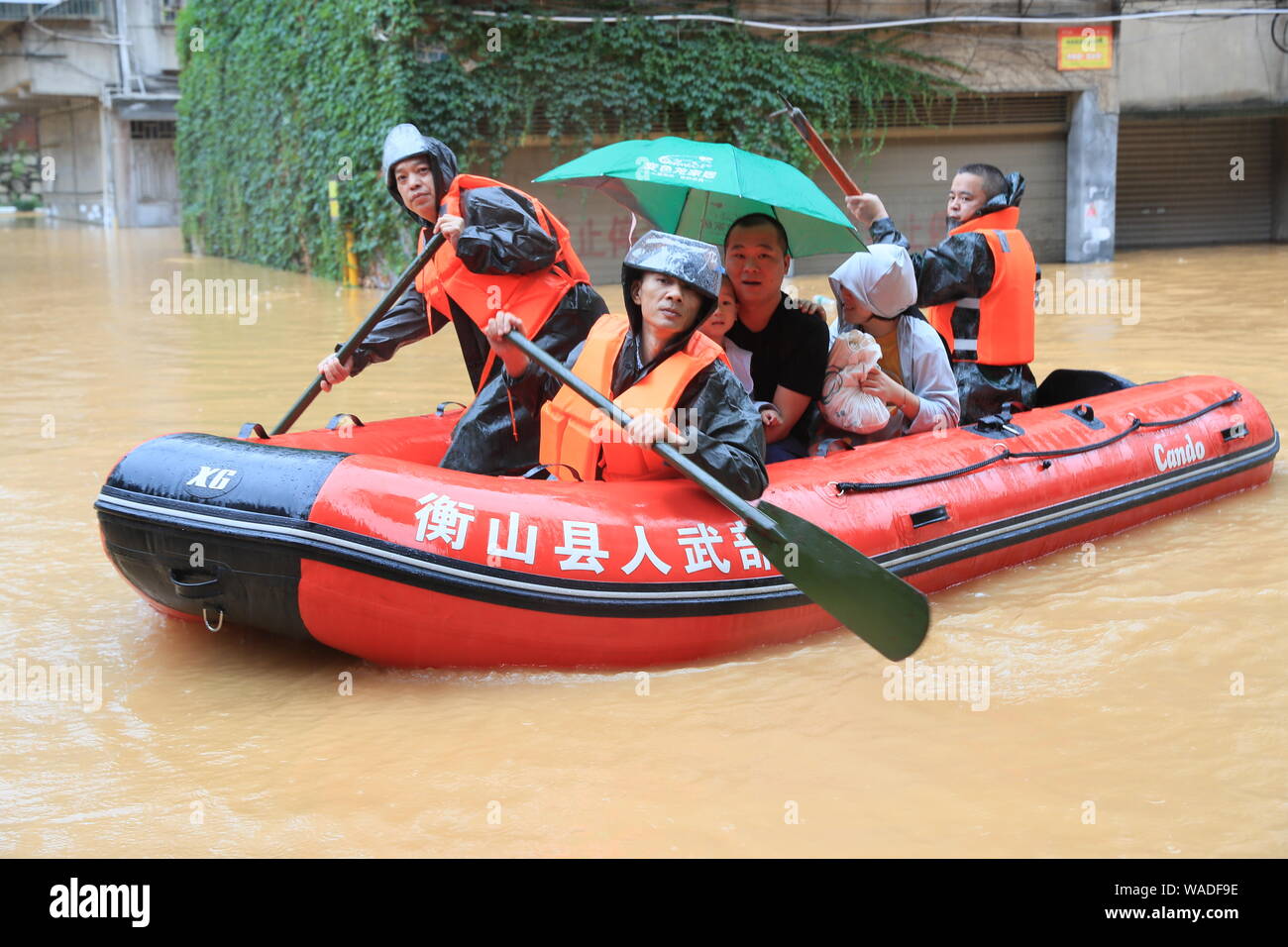 Chinese rescuers evacuate local residents in floodwater caused by a ...