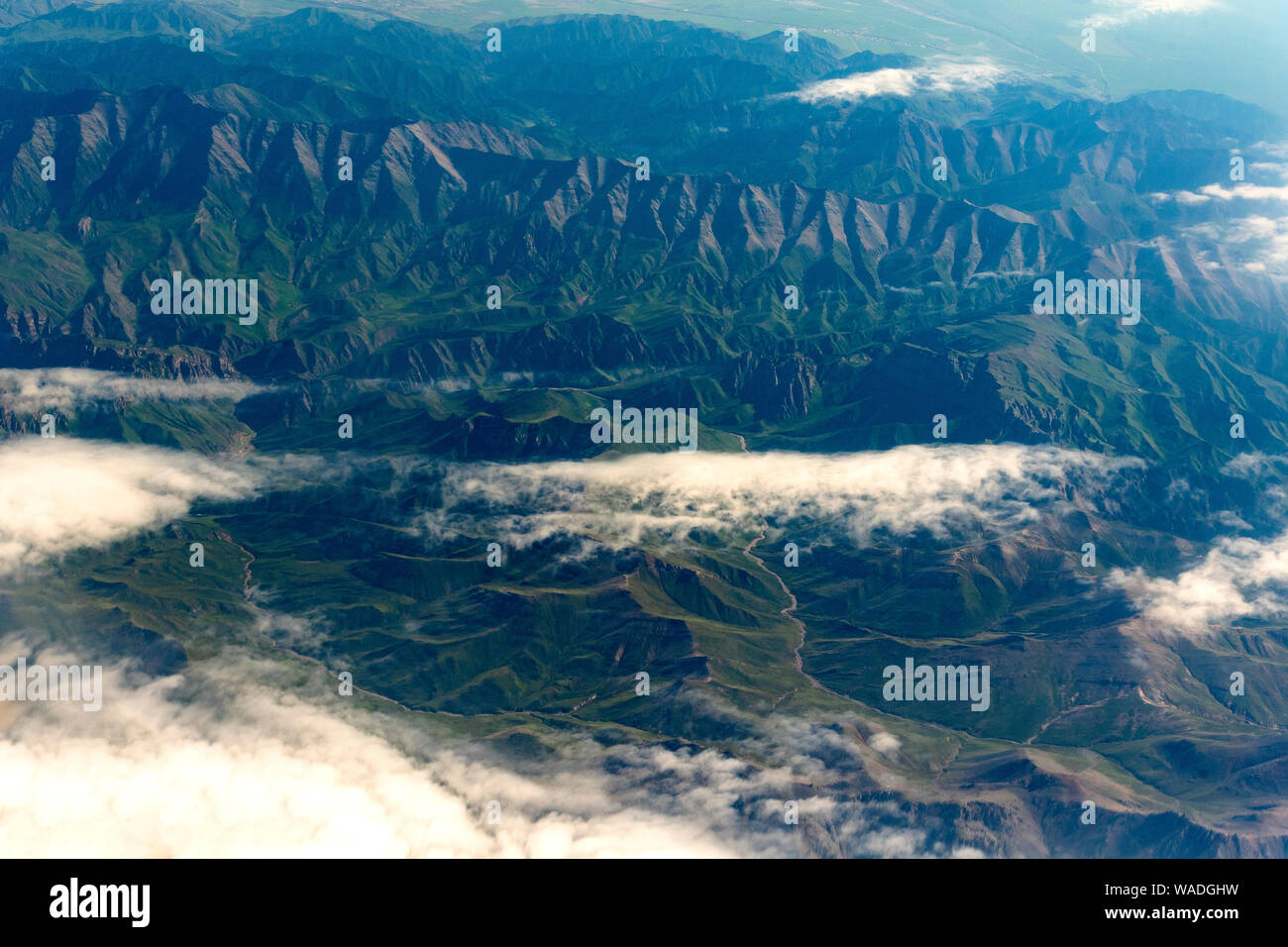 Aerial views of snow mountains in Xinjiang, the largest province in ...